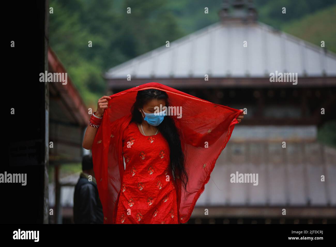 Bhaktapur, Bagmati, Nepal. 30th Aug, 2022. A Hindu woman handles her ...