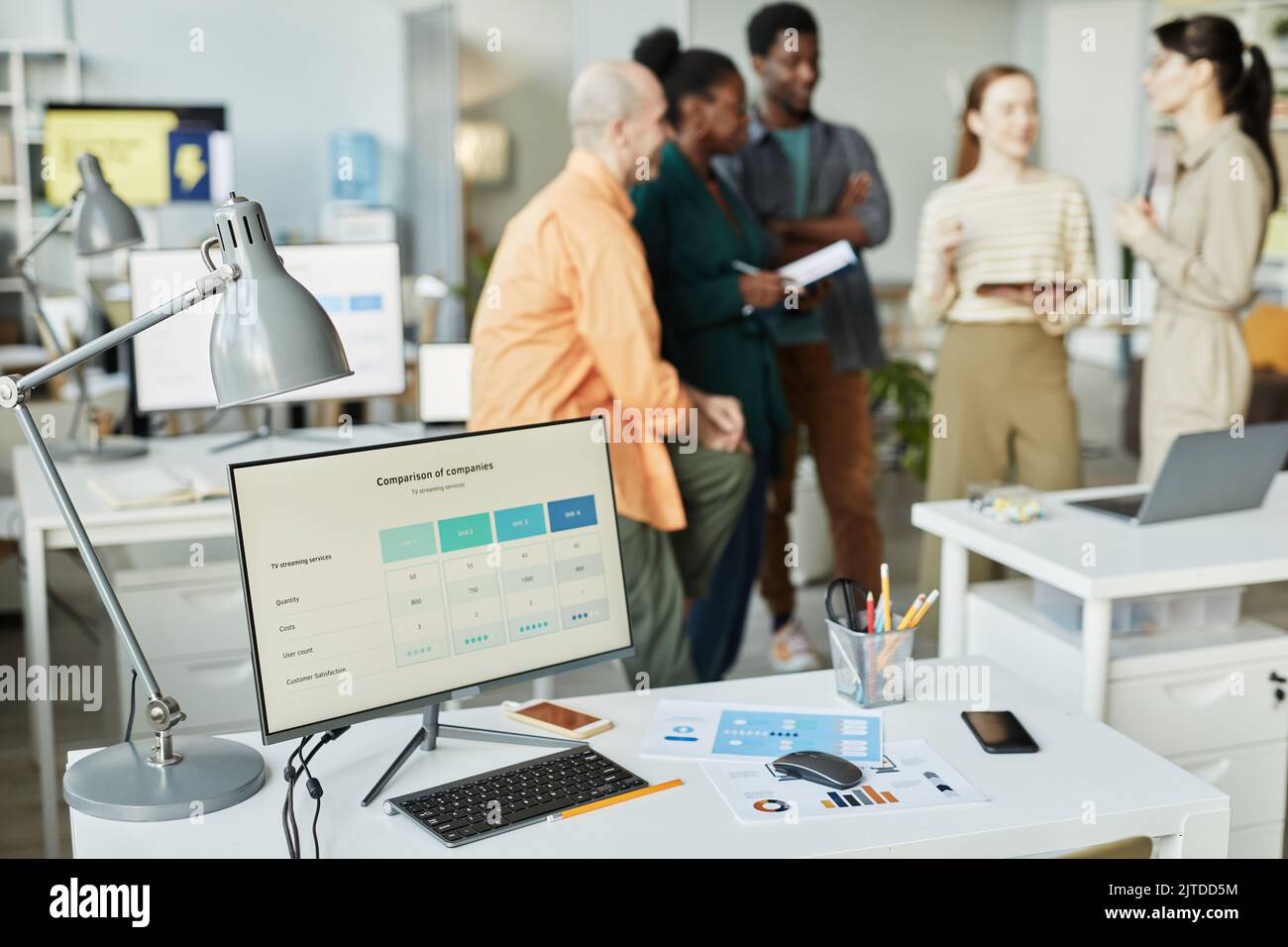 Background image of computer screen with data on workplace and blurred ...
