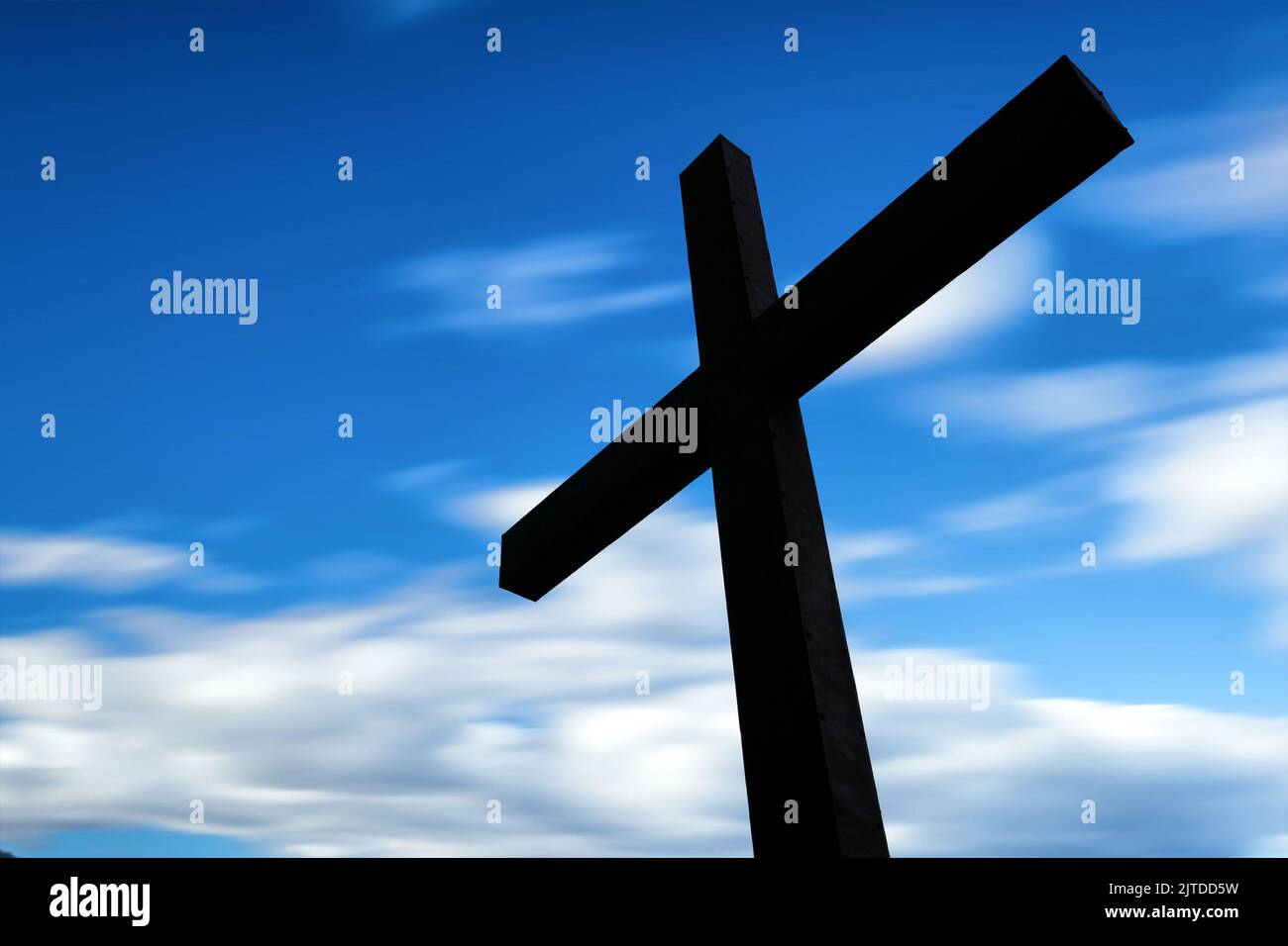 Cross in silhouette with a colorful sky and cloud Stock Photo - Alamy