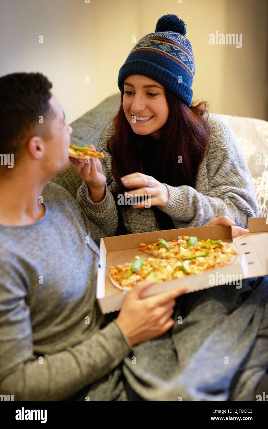 Two men eating pizza on sofa hi-res stock photography and images - Alamy