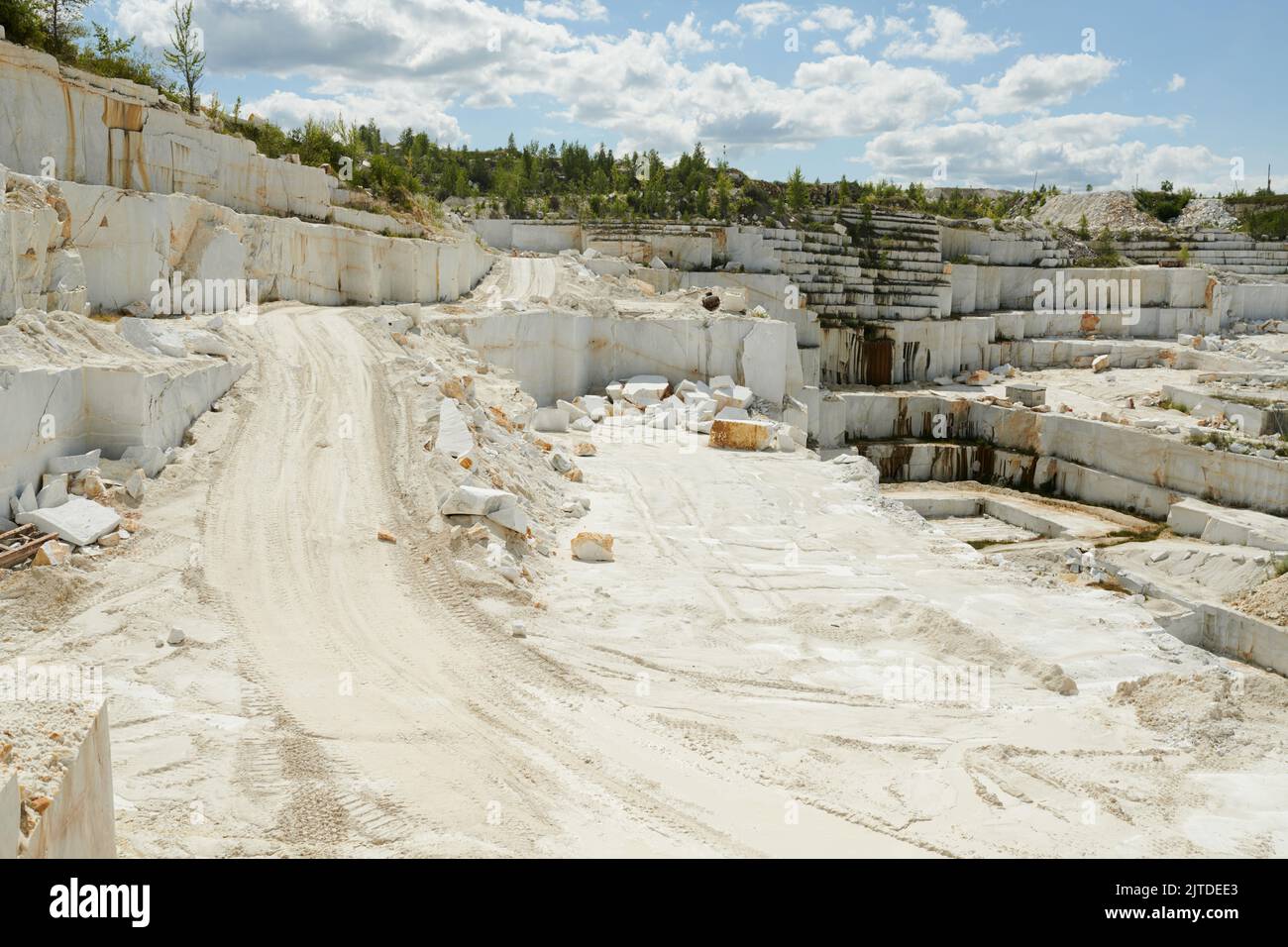 Territory of large marble quarry surrounded by thick white stone walls ...