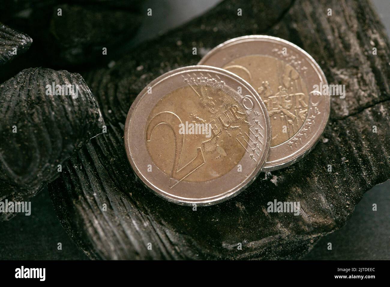 euro coin on a piece of coal.Coal cost. Buying coal in the countries of ...
