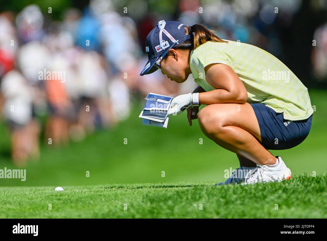 OTTAWA, ON - AUGUST 28: Nasa Hataoka (JPN) closely looks over her lie before hitting her ...