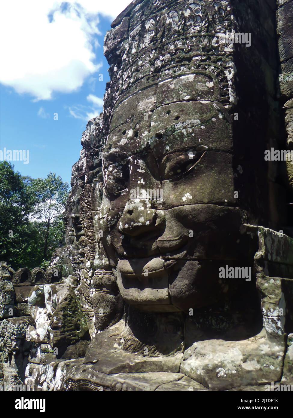 Giant stone faces at Cambodian temple complex Stock Photo - Alamy