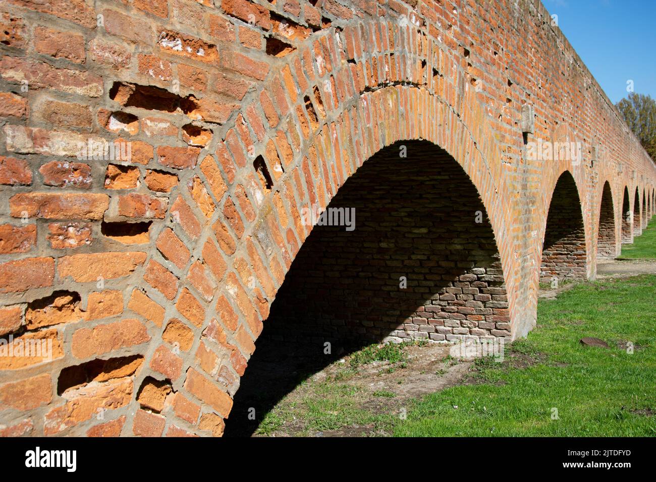 Red brick arches of bridge without water Stock Photo - Alamy