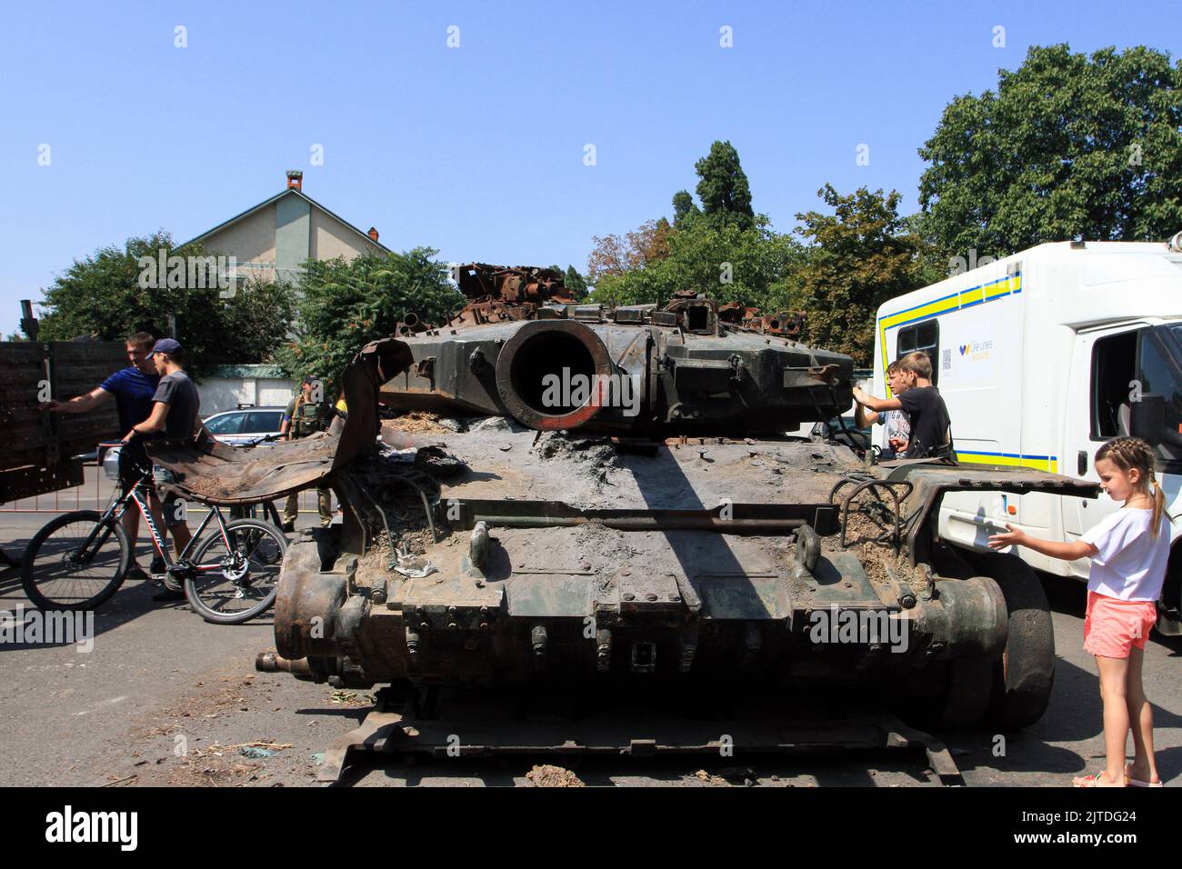Odessa, Ukraine. 27th Aug, 2022. Children are seen near a burned-out ...