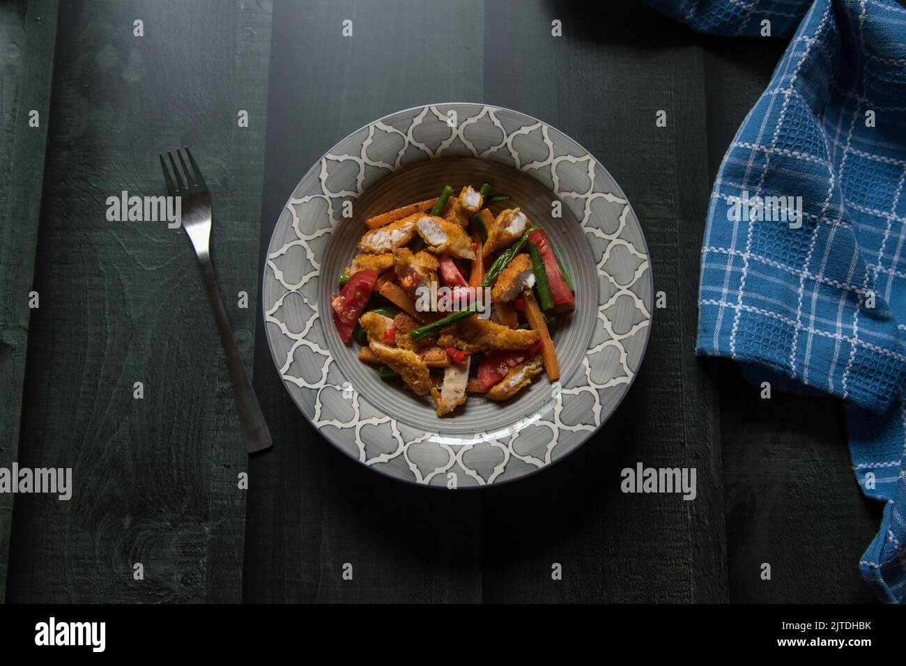 Cooked food bread crumbs and veggies in a bowl. Top view Stock Photo ...