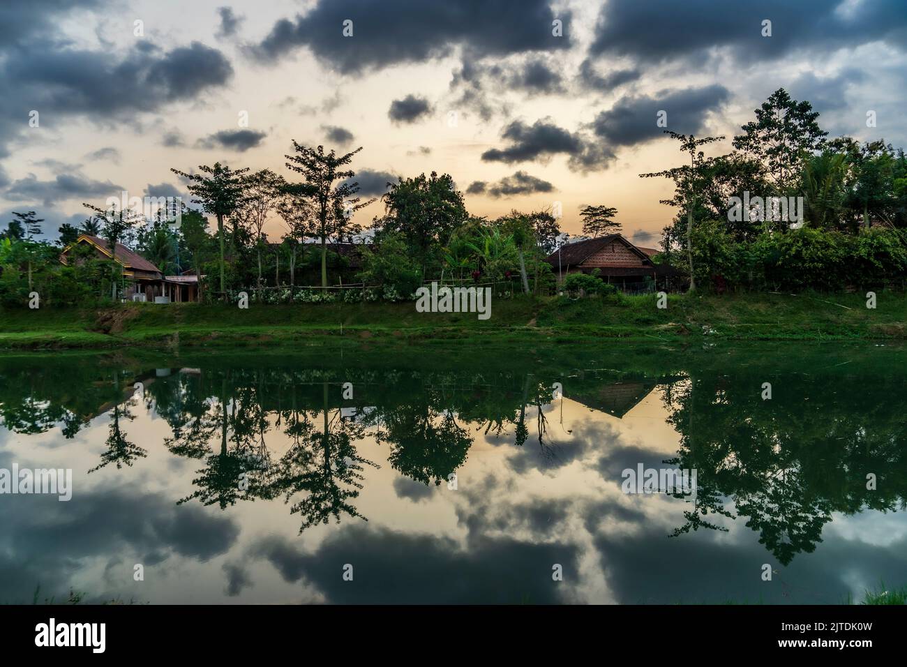 Colorful sunset, sunrise over a wide river. Twilight rays and clouds ...
