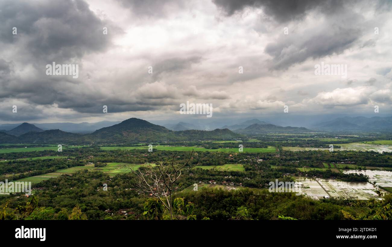 Cloudy Arial view of village with background of mountain in Trenggalek ...