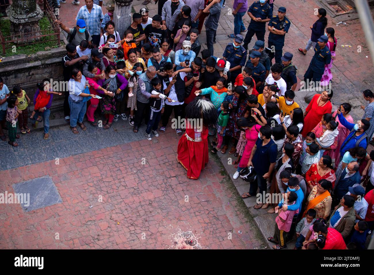 Devotees are pictured as they circumambulate Bagh Bhairab temple on the ...