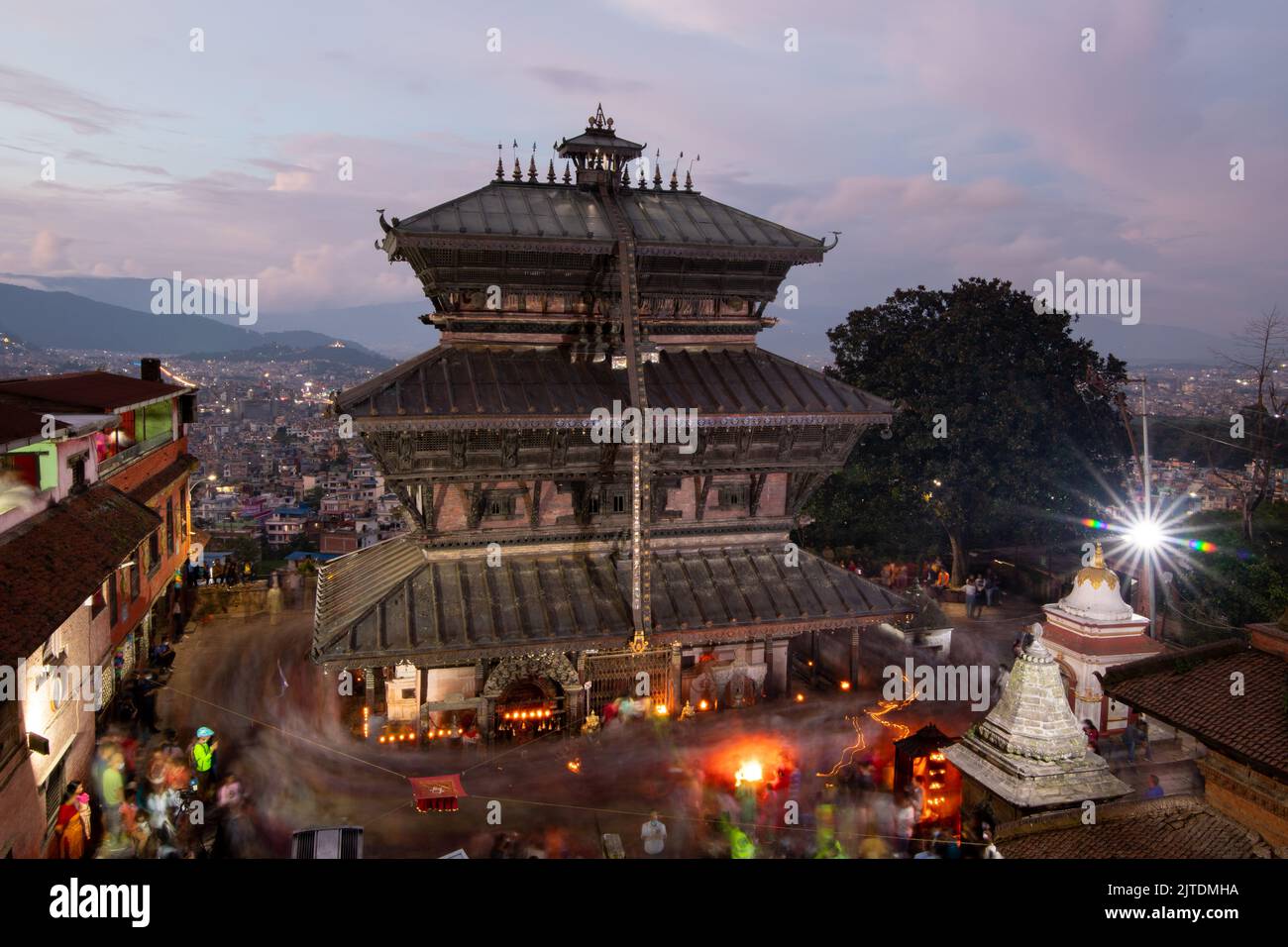 Devotees are pictured as they circumambulate Bagh Bhairab temple on the ...