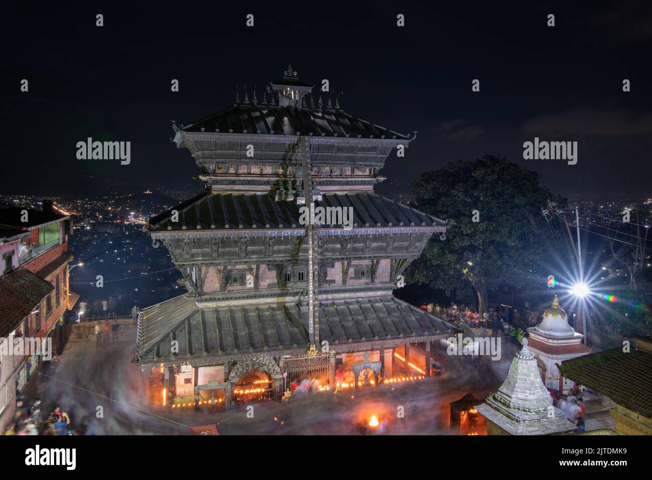 Devotees are pictured as they circumambulate Bagh Bhairab temple on the ...