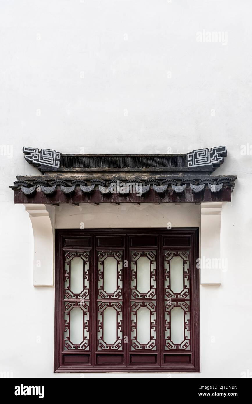A closed classically designed window of a building in Shanghai, China ...