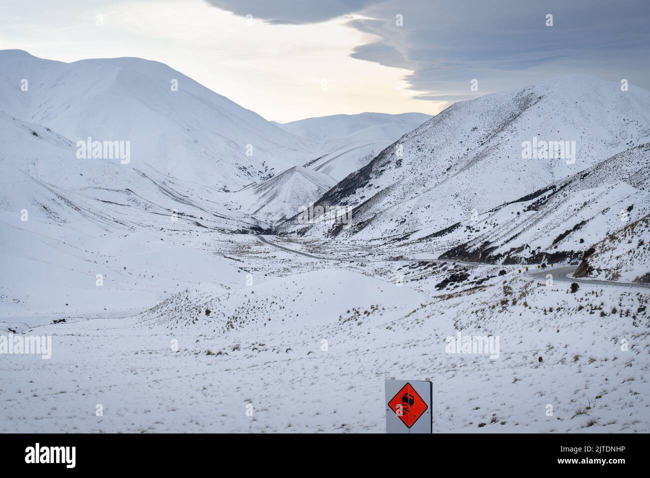 The long and winding road at Lindis Pass covered in snow. Slippery ...