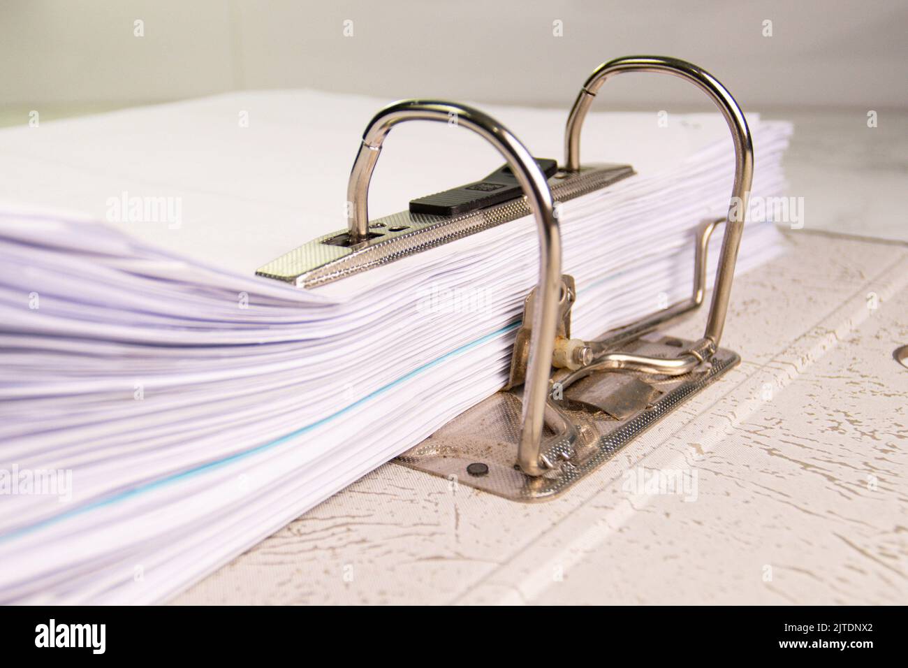 white paper stack in folder file for a business contract, income ...