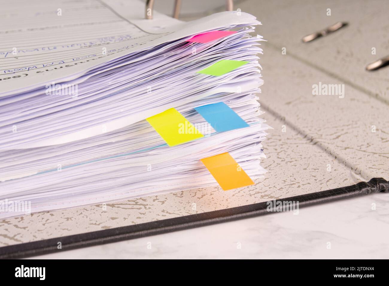 white paper stack in folder file for a business contract, income ...