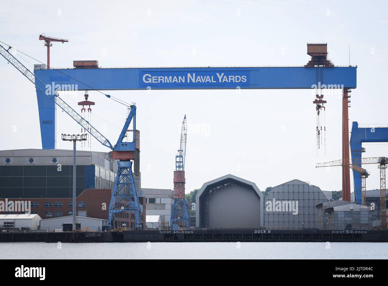 Kiel, Germany. 15th Aug, 2022. Two cranes and several shipyard halls ...