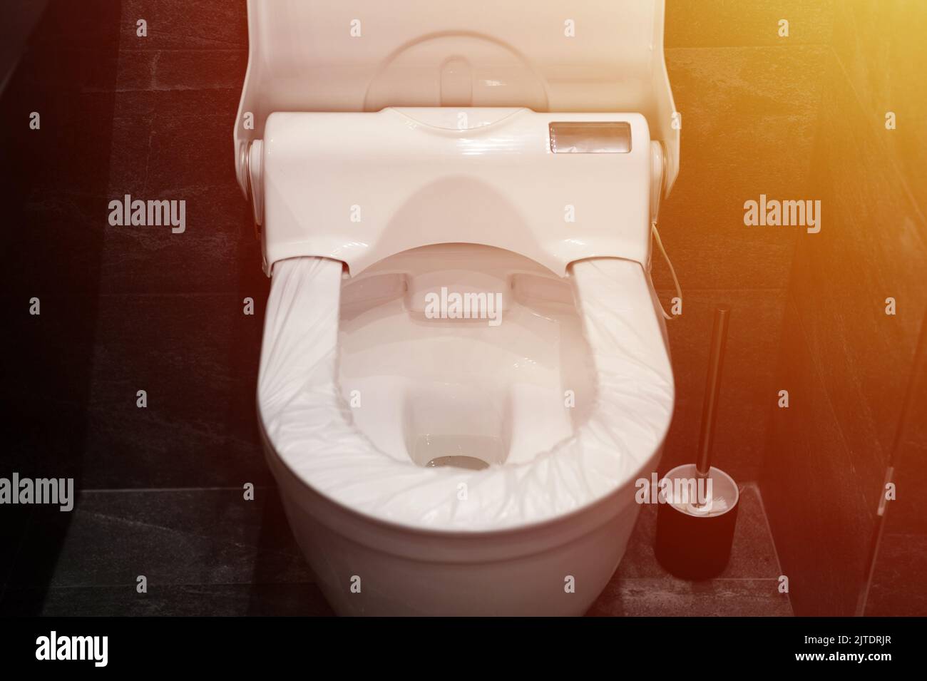 disposable cover pad on the rim of the toilet seat. wc hygiene system ...