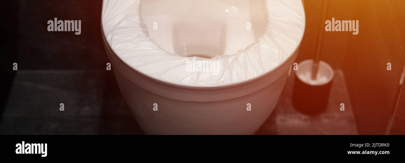 disposable cover pad on the rim of the toilet seat. wc hygiene system ...