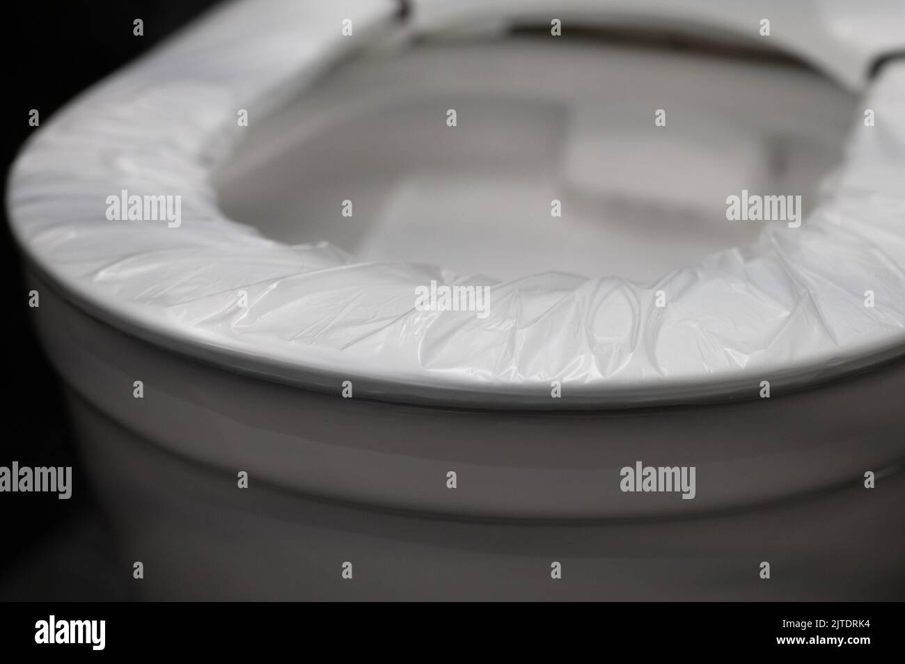 disposable cover pad on the rim of the toilet seat. wc hygiene system ...
