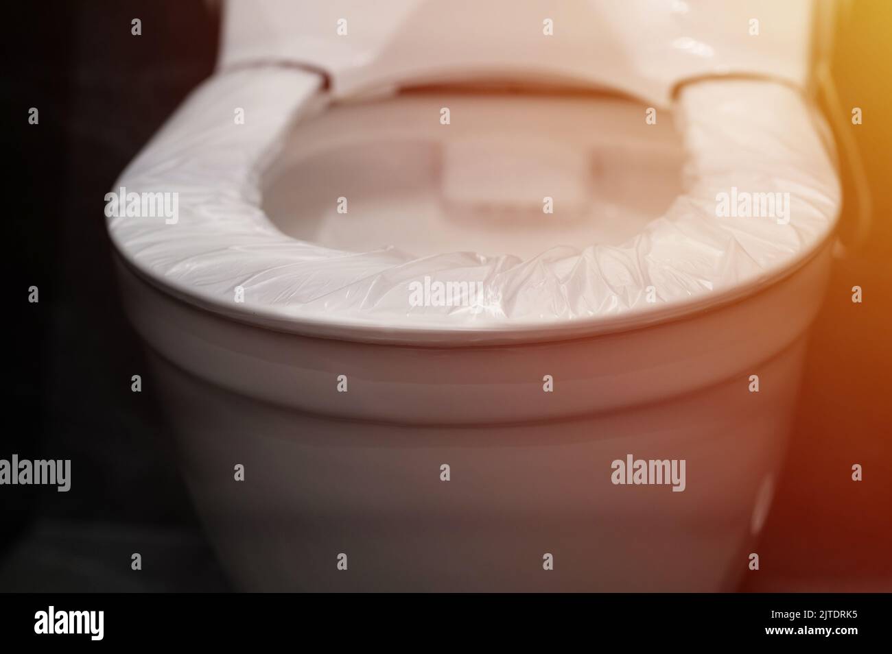 disposable cover pad on the rim of the toilet seat. wc hygiene system ...