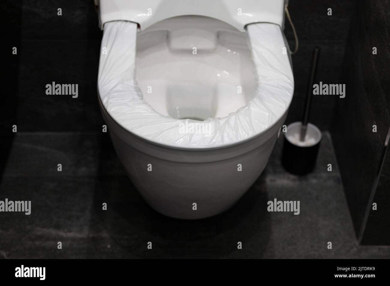 disposable cover pad on the rim of the toilet seat. wc hygiene system ...