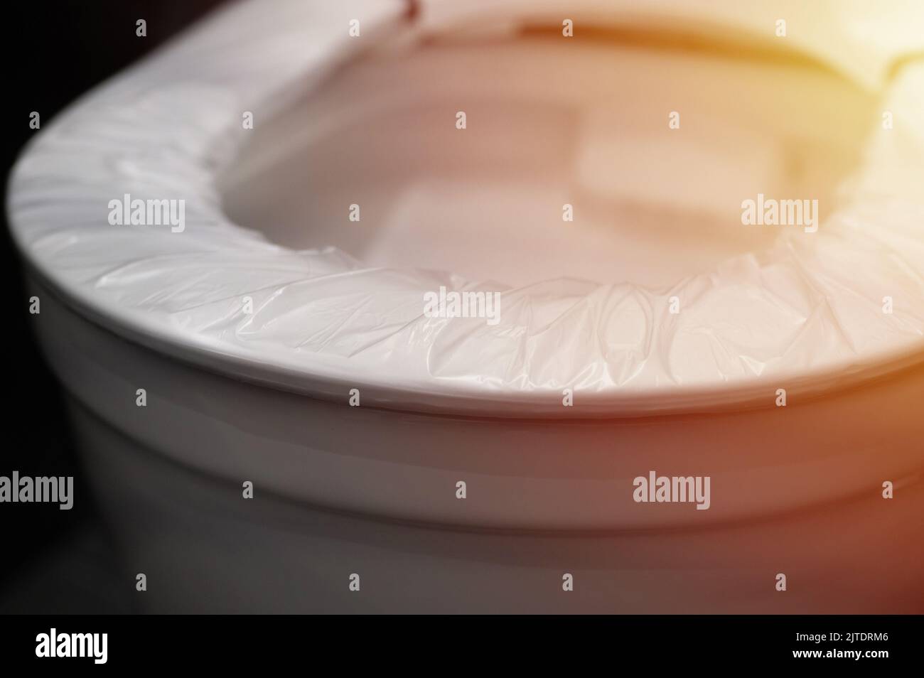 disposable cover pad on the rim of the toilet seat. wc hygiene system ...