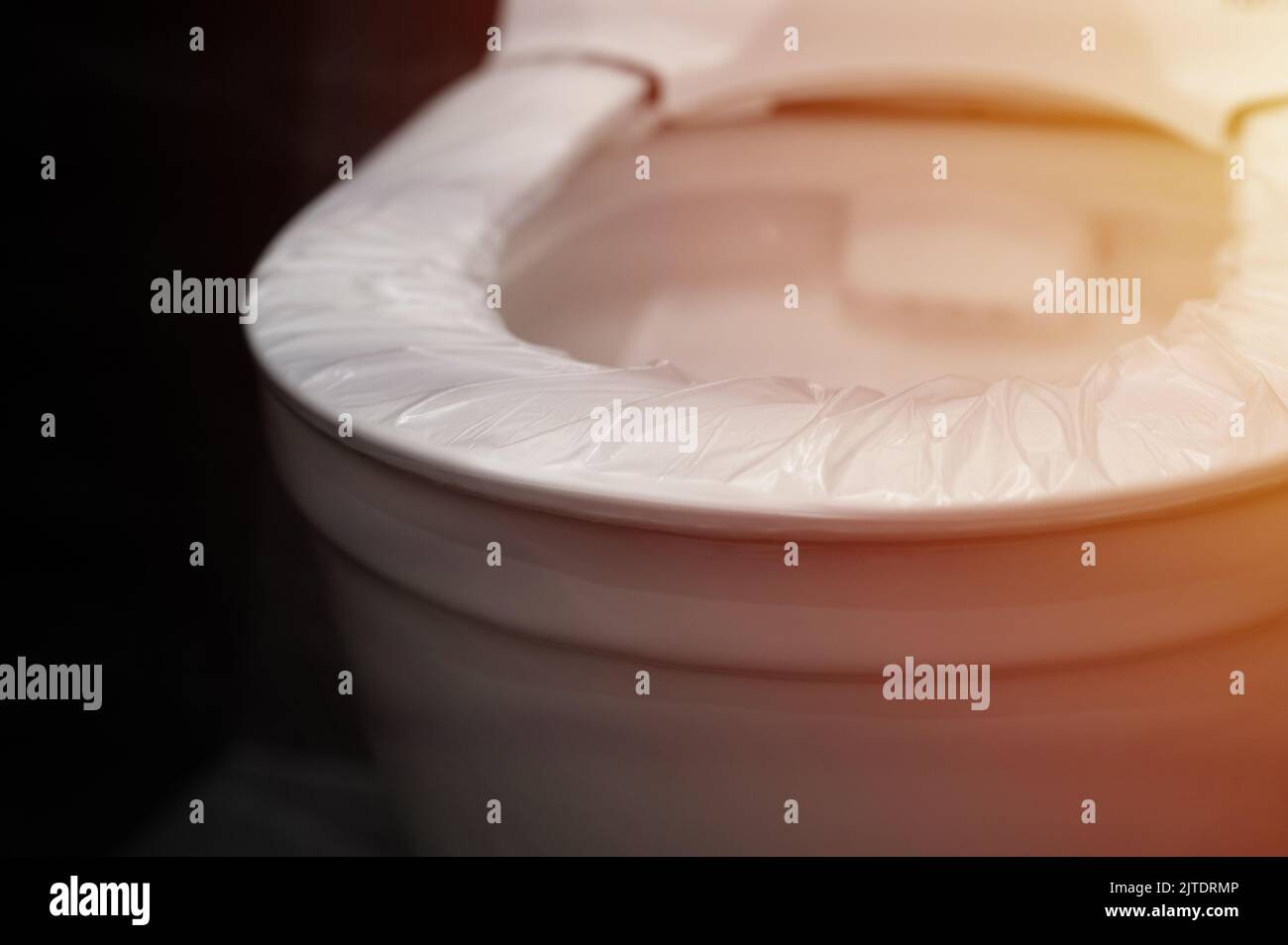 disposable cover pad on the rim of the toilet seat. wc hygiene system ...