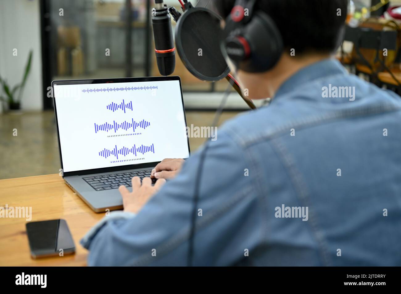 Talented young Asian male radio host running his online radio his ...