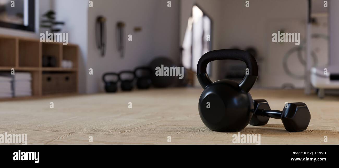 Fitness training gym background with kettlebell and dumbbell on the ...