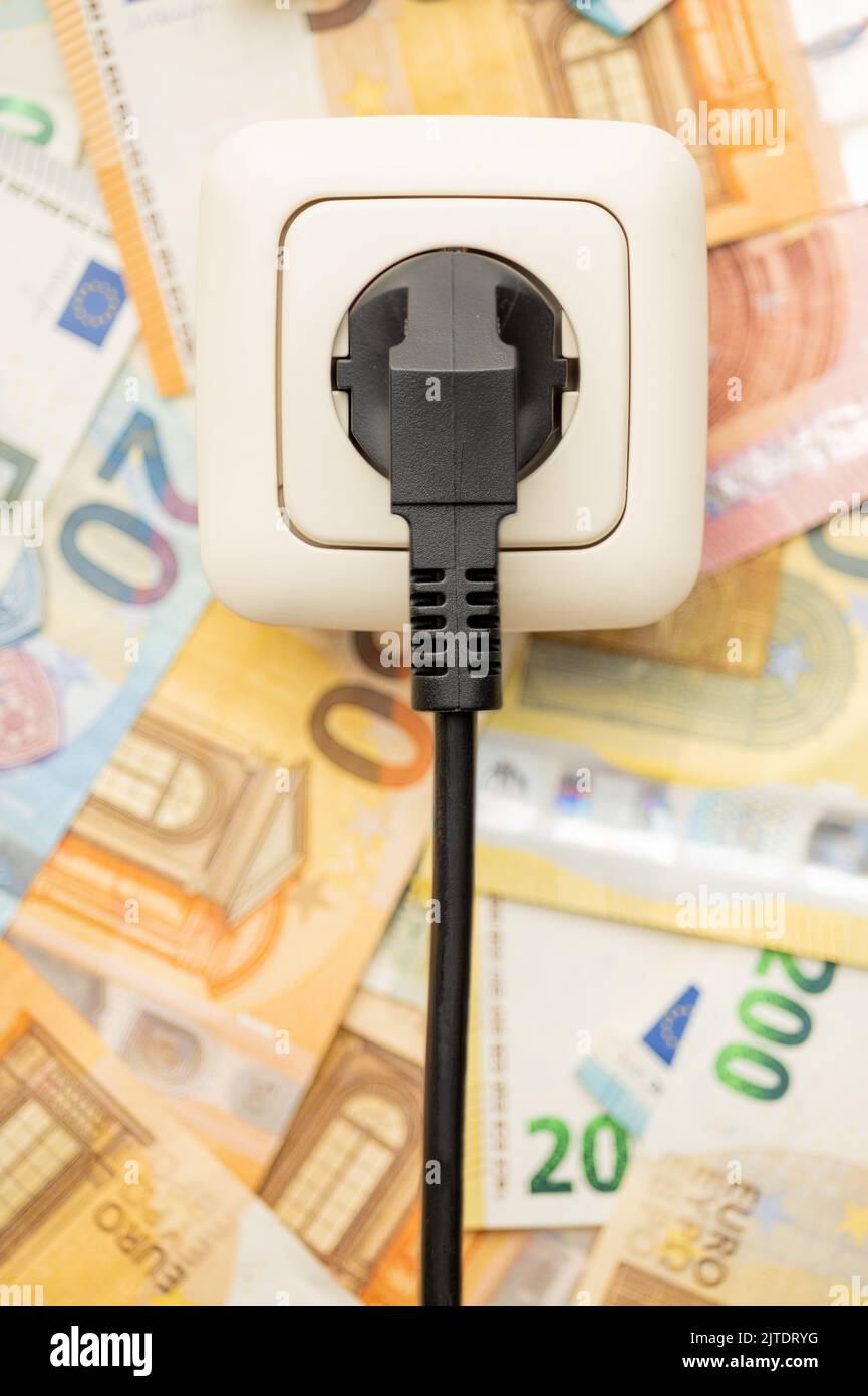 Electric wall socket and euro money. Concept of the increasing ...