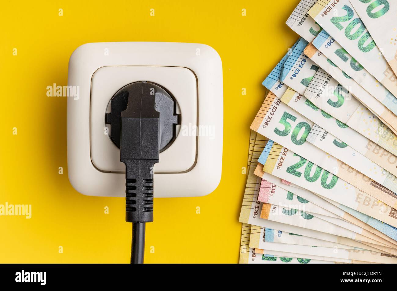 Electric wall socket and euro money. Concept of the increasing ...