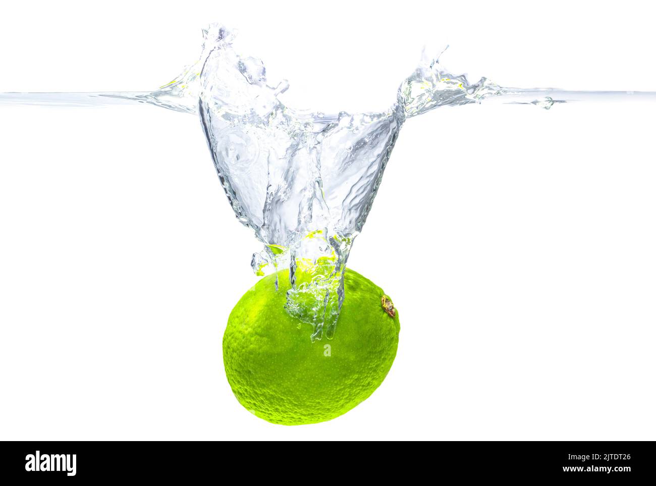 Fresh whole lime splashing underwater isolated on white background ...