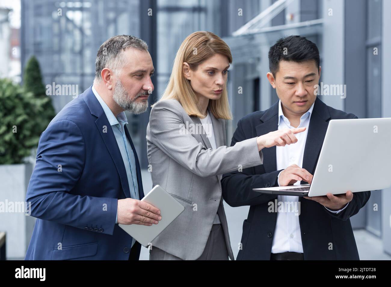 Successful business team, three colleagues businessman and ...