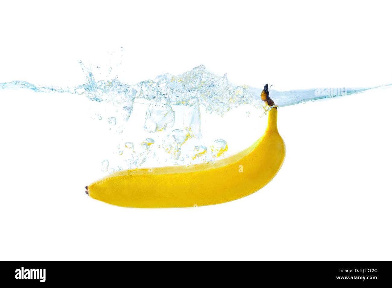 Ripe banana dropped in water with bubbles and splashes isolated on white background Stock Photo ...