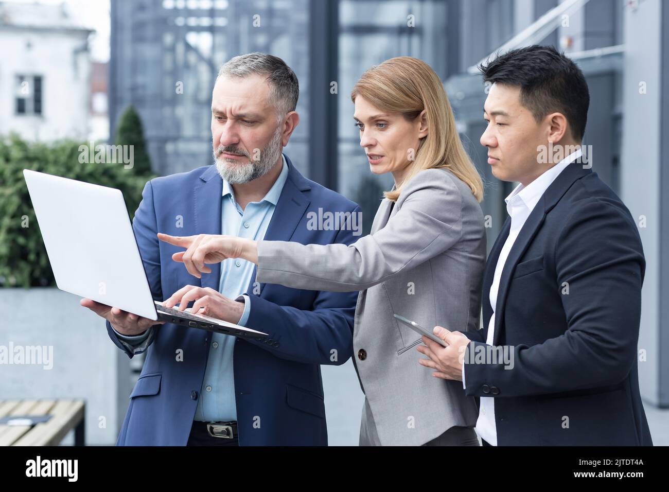 Successful business team, three colleagues businessman and ...