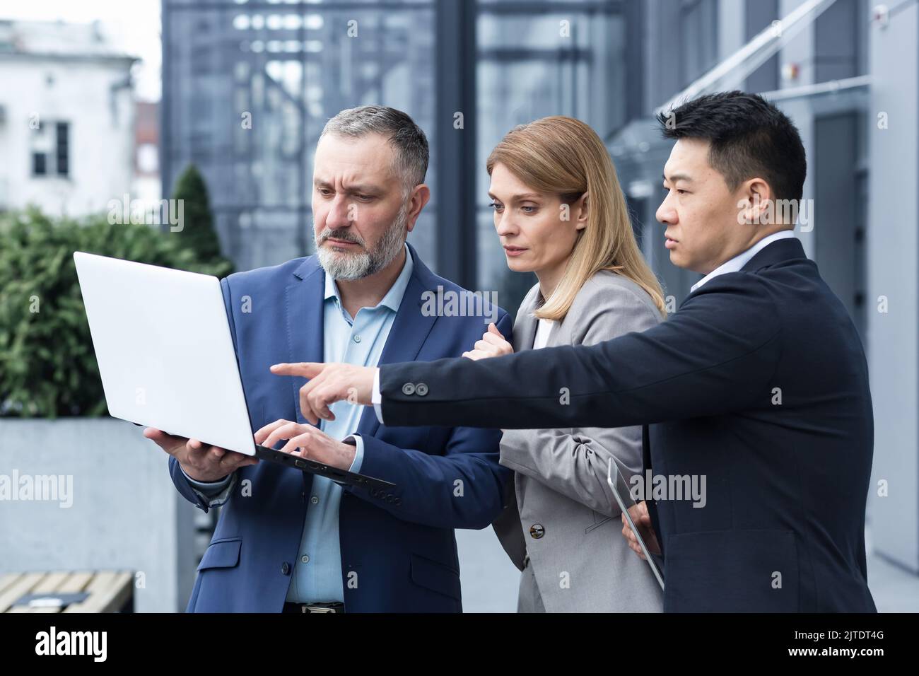 Successful business team, three colleagues businessman and ...