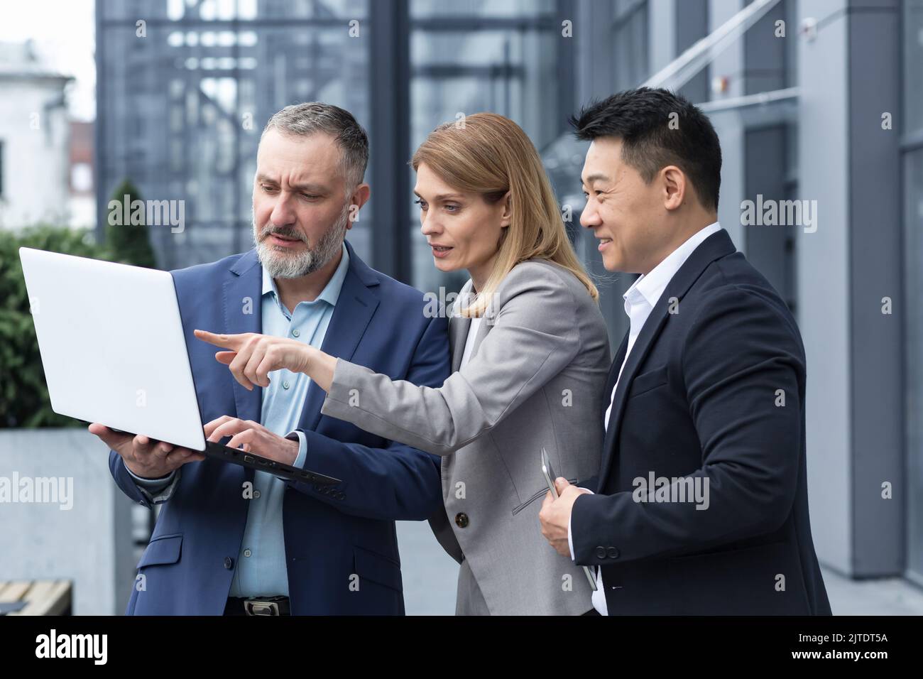 Successful business team, three colleagues businessman and ...