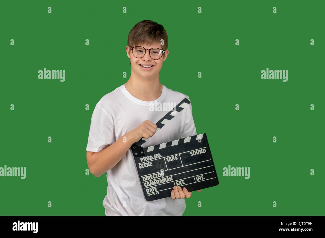 Young film director looking enjoyed and confident Stock Photo - Alamy