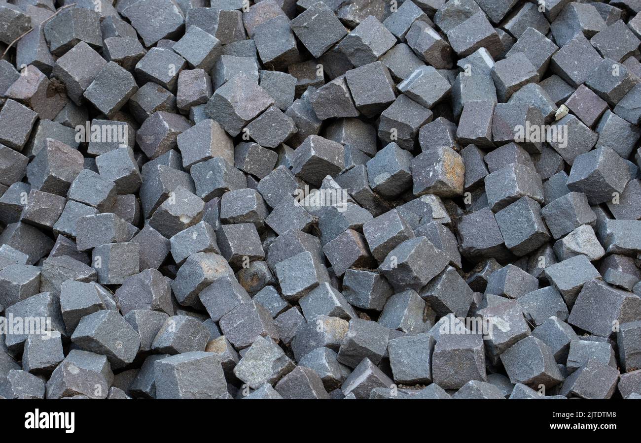 a close-up with many cubic stones, texture, pile Stock Photo - Alamy