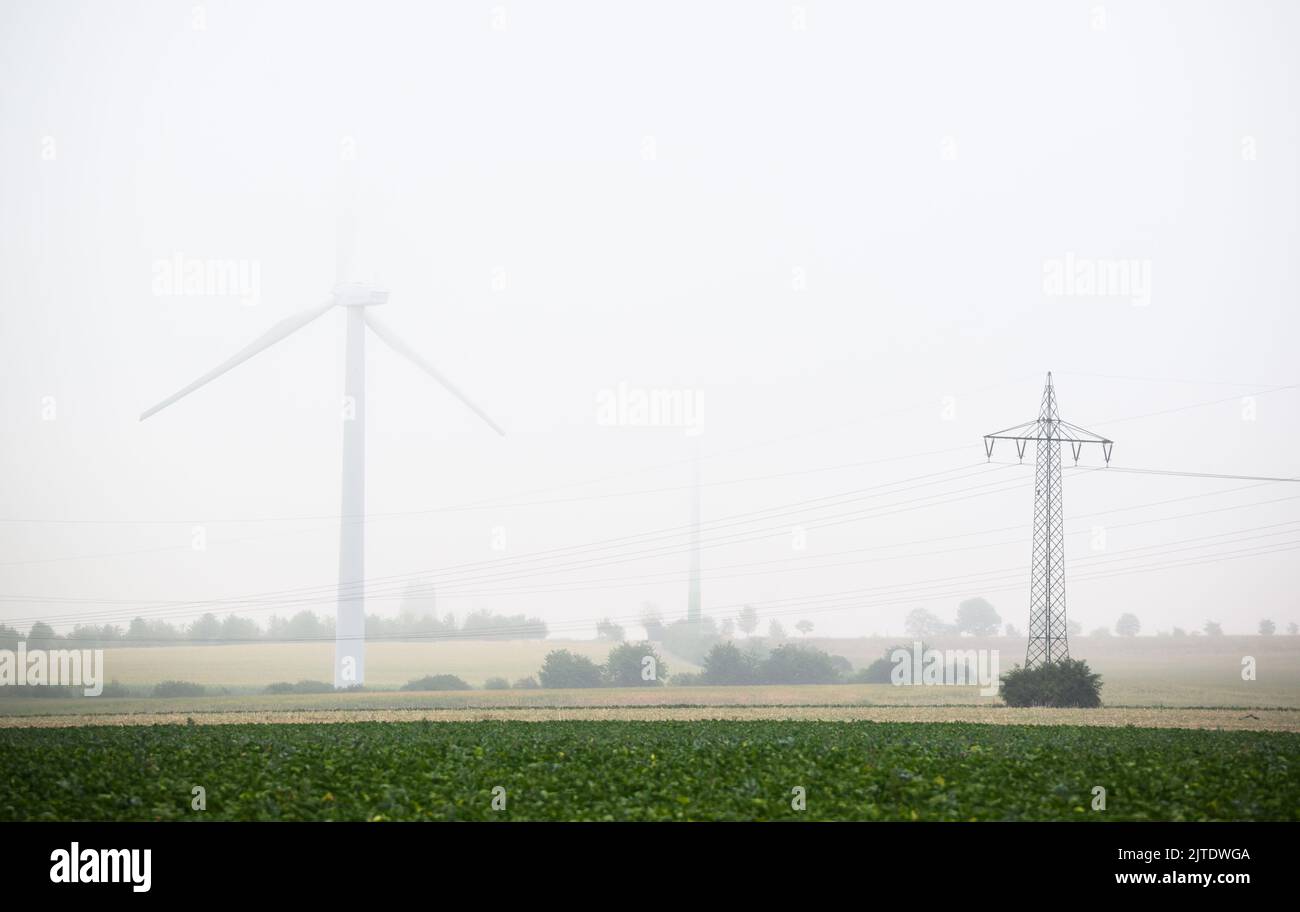 Springe, Germany. 30th Aug, 2022. Wind turbines disappear in the ...