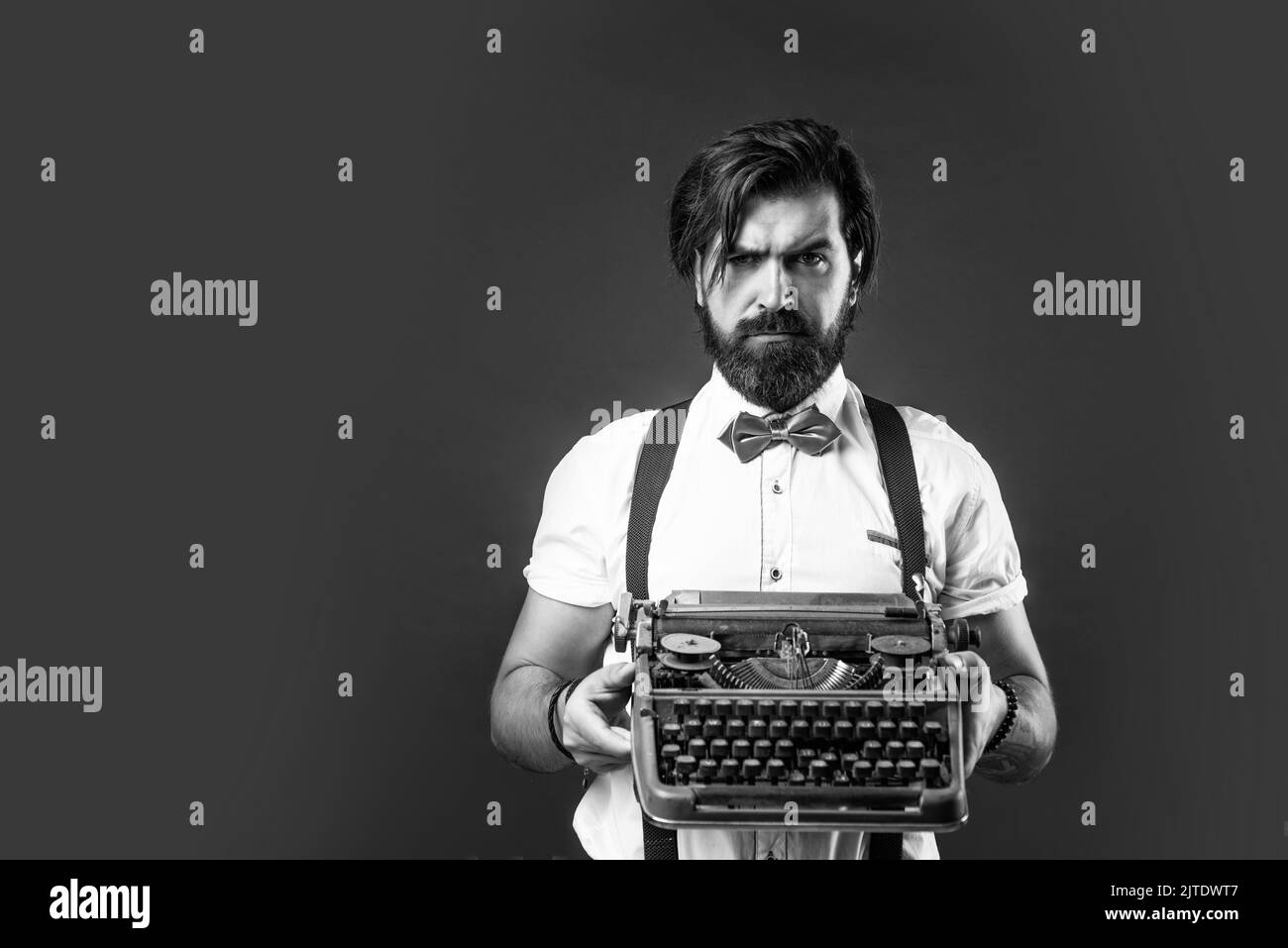 journalistic concept. brutal handsome man with moustache. mature typist ...