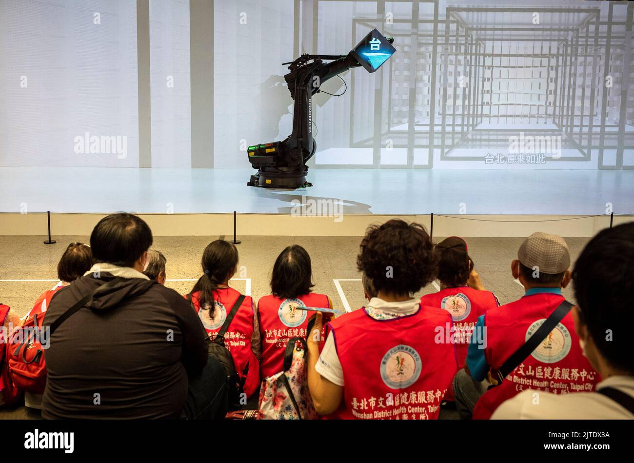 Taipei. 30th Aug, 2022. Tour group watches robot show as they visit The ...