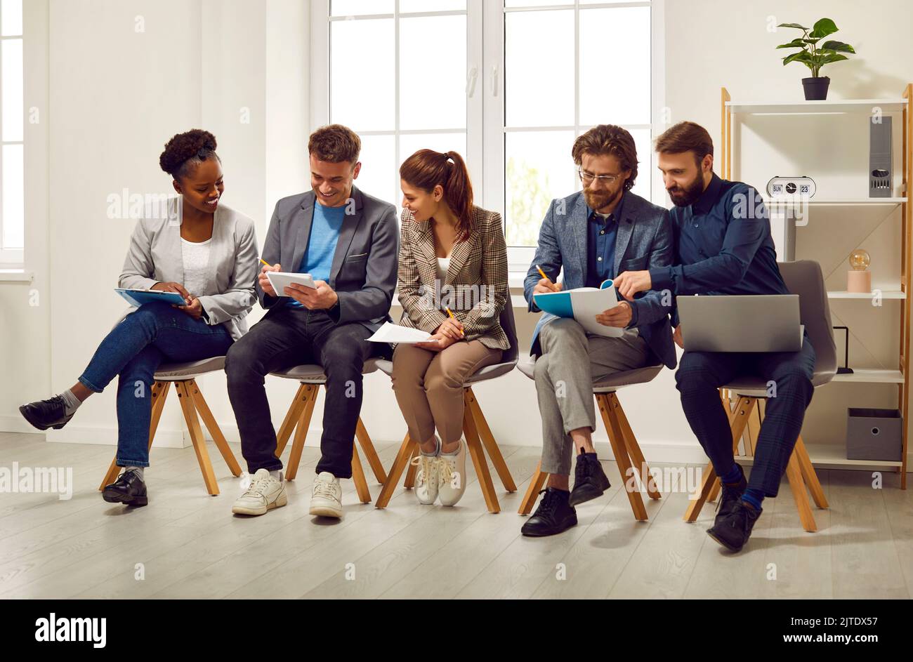 Candidates for position in business office communicate together and ...