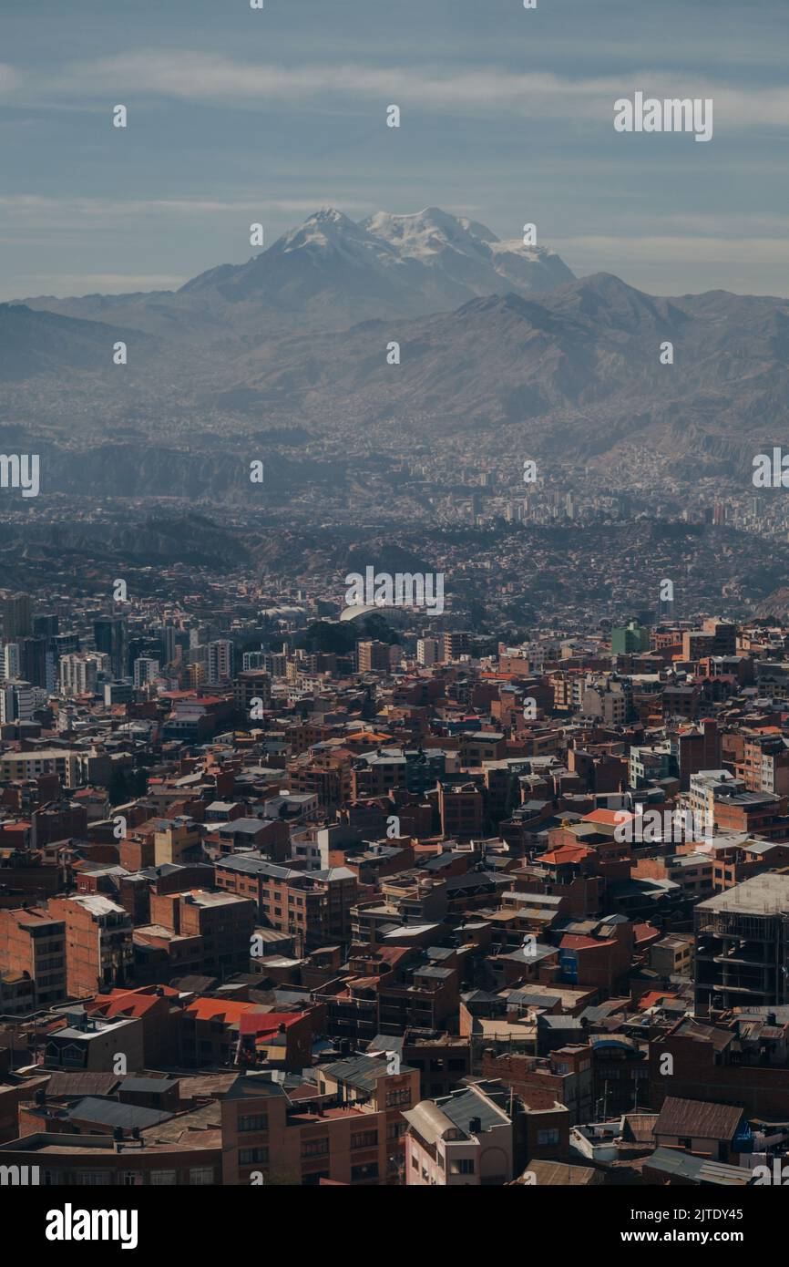 A high-angle of an urban area that is built in a valley surrounded by ...