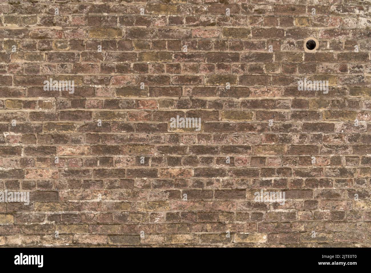 Different several colored wall close up exactly laid bricked stones to ...