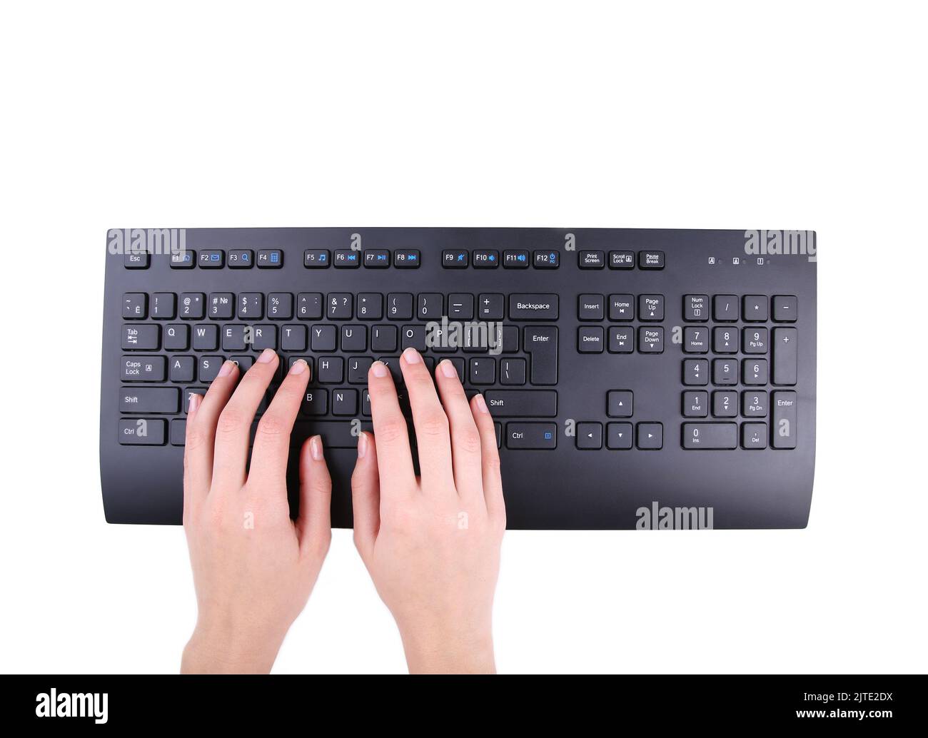 Female hands or woman office worker typing on the black keyboard ...