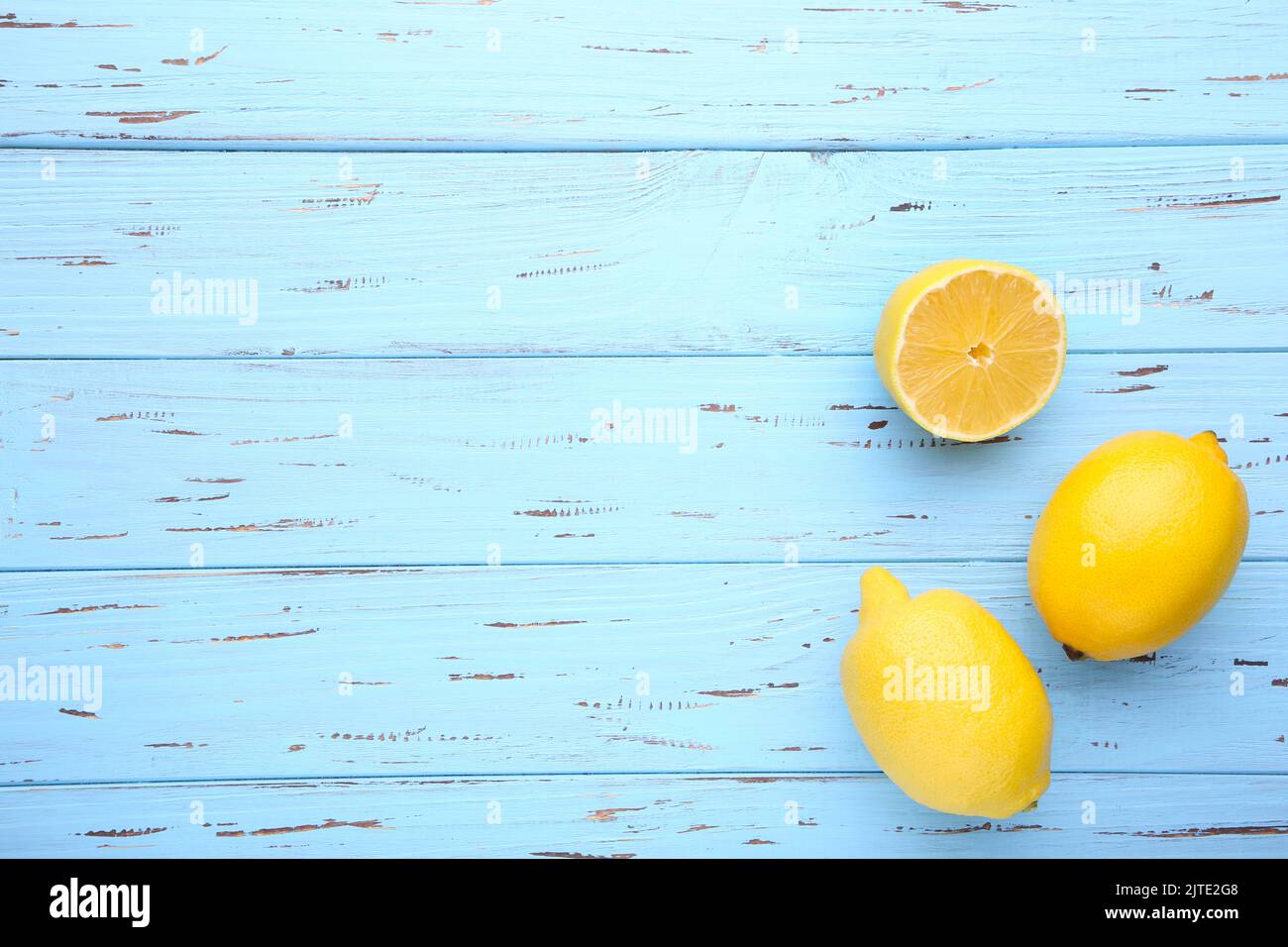 Lemon and half of lemon on blue background. Fresh tropical fruit Stock ...