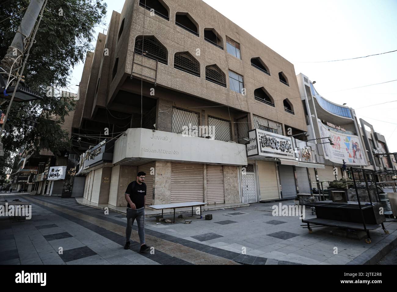 Baghdad, Iraq. 30th Aug, 2022. A view of closed shops during a nationwide curfew imposed by Iraq ...