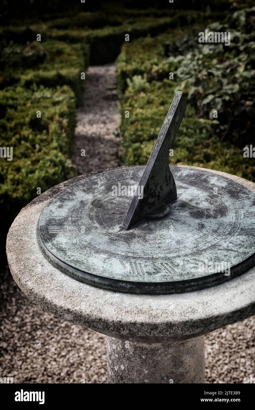 A sundial in the formal walled garden of an English country house Stock ...